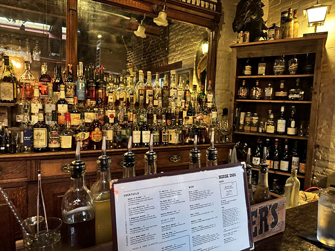 The bar doesn't just serve drinks – it tells stories through bottles, each one waiting to become part of your evening's narrative.