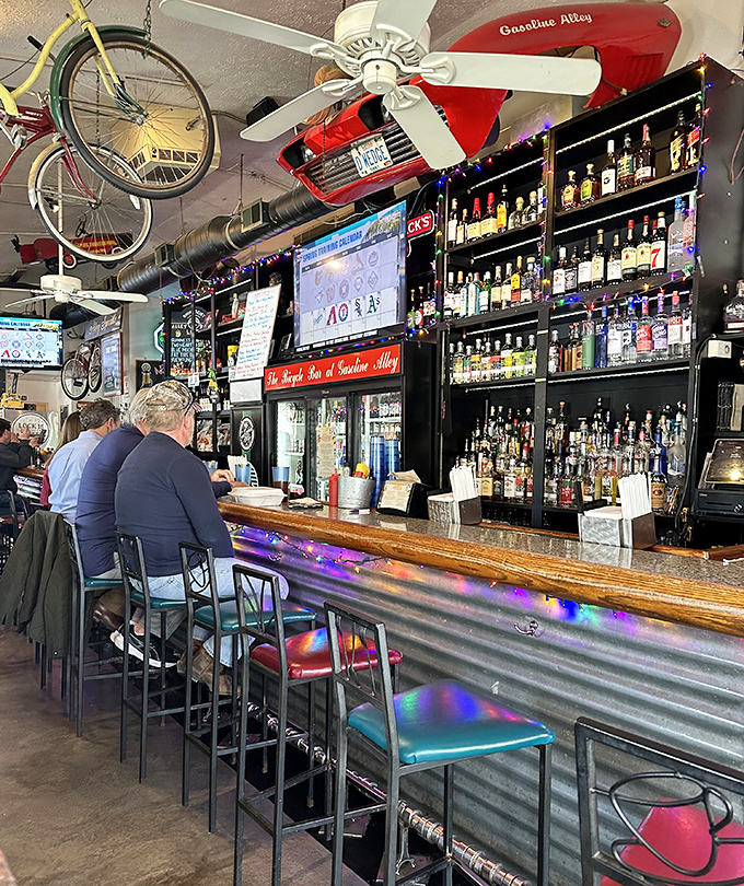 The bar doesn't just serve drinks &ndash; it's a front-row seat to the controlled chaos of memorabilia that defines Gasoline Alley's charm.