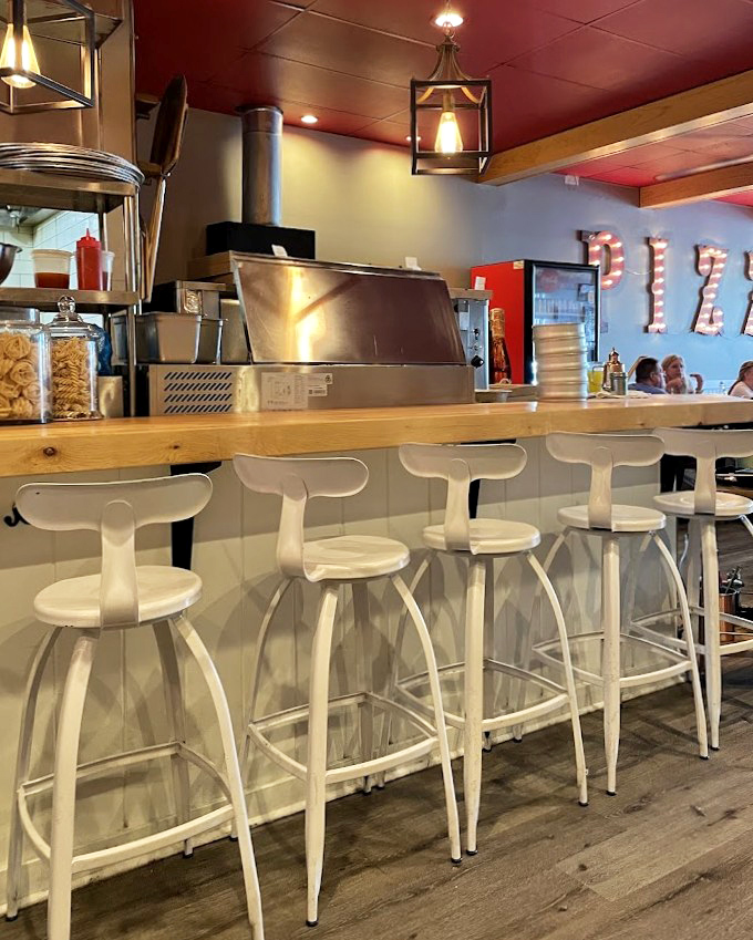 Bar seating where pasta dreams come true. Watch the kitchen magic happen while contemplating your next carb-loaded adventure.