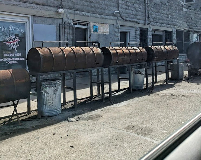 The impressive lineup of smokers where the magic happens. These weathered vessels hold the secrets to perfect barbecue.