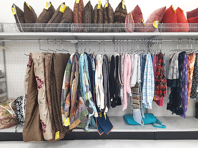 Curtains, tablecloths, and bedding galore&mdash;textile treasures hanging like colorful flags in this fabric United Nations.