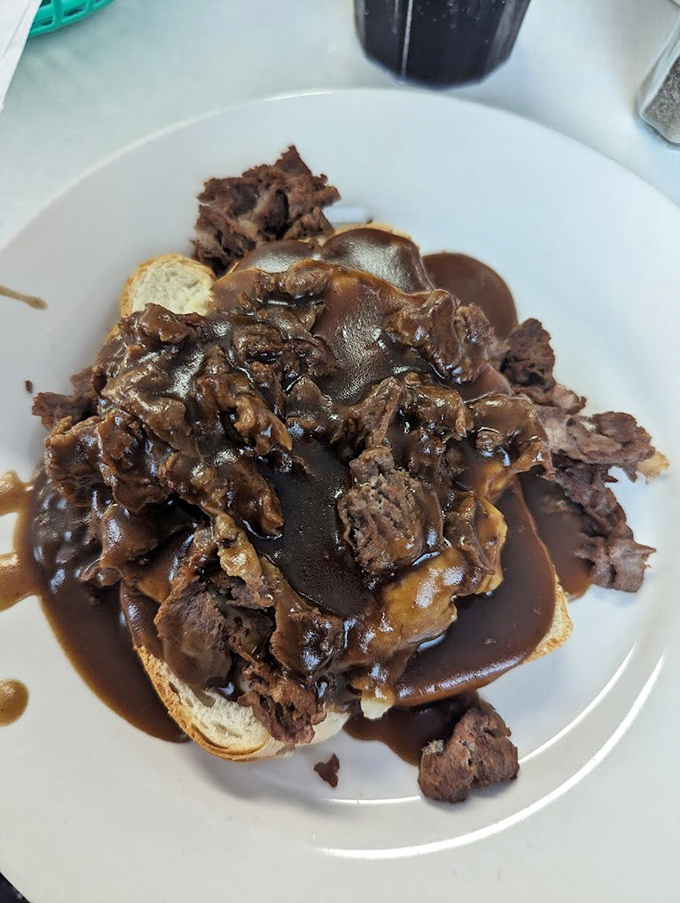 The beef Manhattan isn't just comfort food&mdash;it's therapy on a plate, with tender meat and gravy cascading over bread islands like a delicious waterfall.