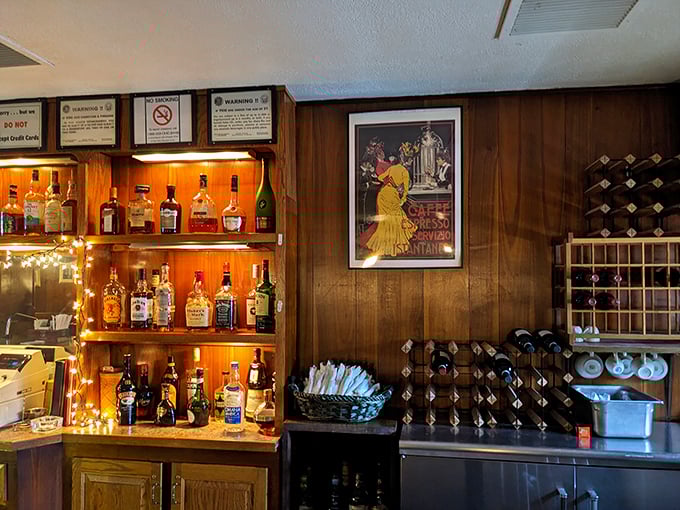 The bar area's wood paneling and vintage Italian poster create that perfect old-school ambiance that chain restaurants spend millions trying unsuccessfully to replicate.