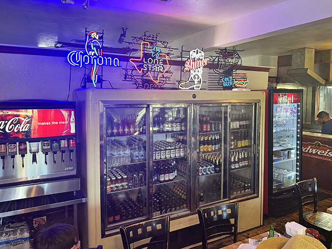 The beer cooler shrine&mdash;where cold Lone Stars and local brews wait patiently to help wash down those monumental burgers.