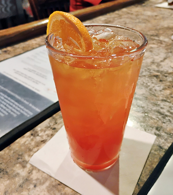 A sunset in a glass that promises relaxation with every sip. The perfect companion while waiting for your seafood feast to arrive.