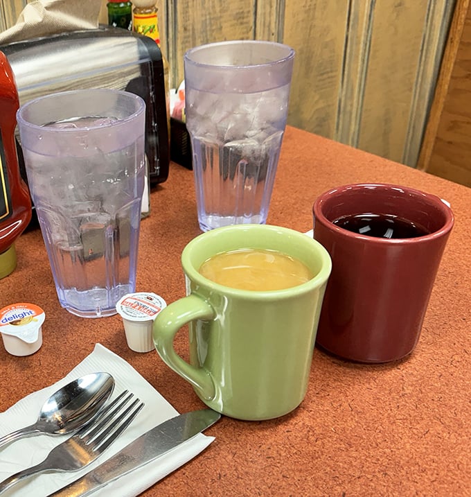 Classic diner mugs in cheerful colors&mdash;where coffee tastes better because someone keeps refilling it without you asking.