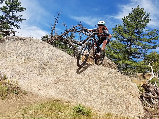 Mountain bikers tackle granite slickrock with the determination of someone chasing the last piece of pie at Thanksgiving.