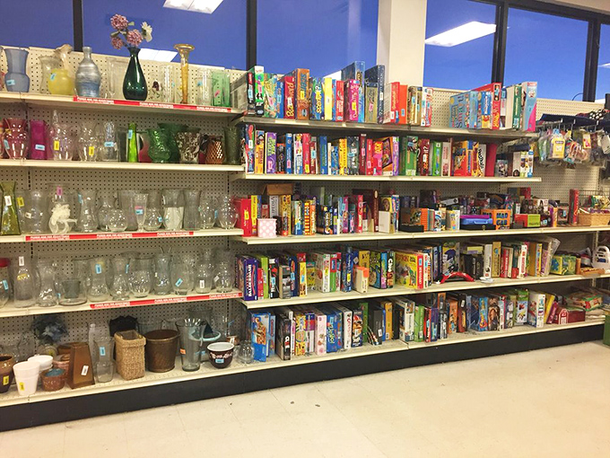 Board games and glassware galore! That vintage vase might have graced someone's wedding table, while those colorful tumblers await your next backyard barbecue.