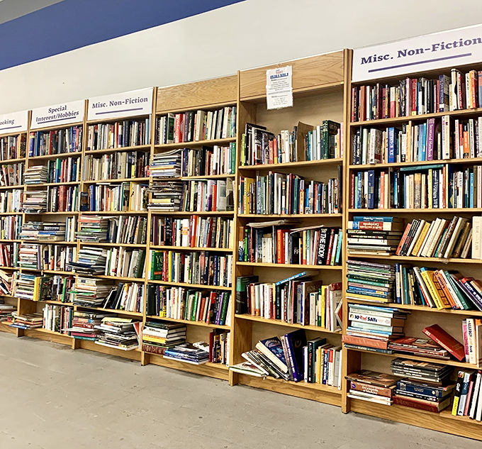 Bibliophile heaven where dog-eared paperbacks and pristine hardcovers create a literary buffet more satisfying than any all-you-can-eat restaurant.