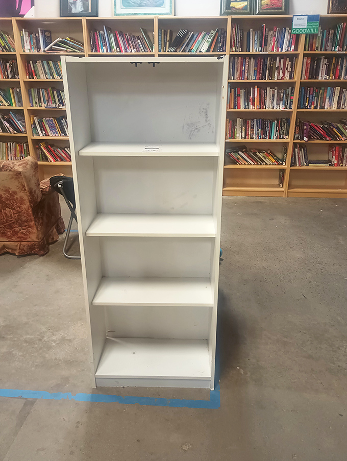 A bookworm's paradise with shelves that whisper possibilities. That empty white bookcase is just waiting to house your literary treasures or display collection.