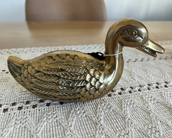 This brass duck figurine has such attitude! Probably spent decades judging someone's living room decor before migrating to this antique mall.