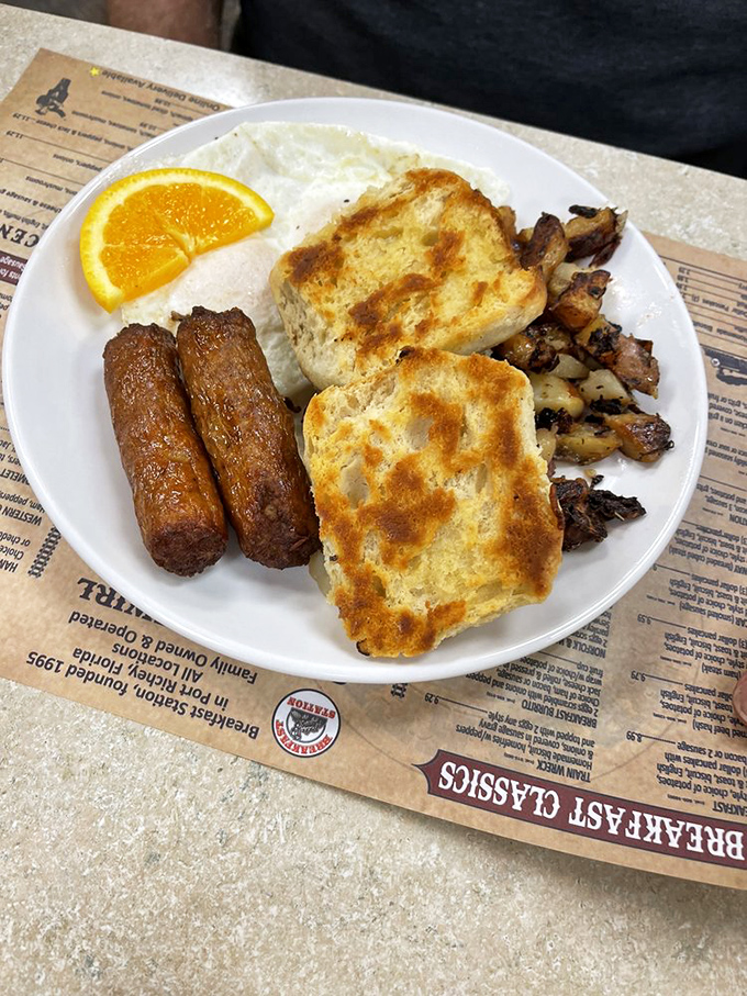 Breakfast fundamentals executed flawlessly: eggs, sausage, potatoes, and toast. Like a perfectly harmonized quartet, each element plays its part without overshadowing the others.