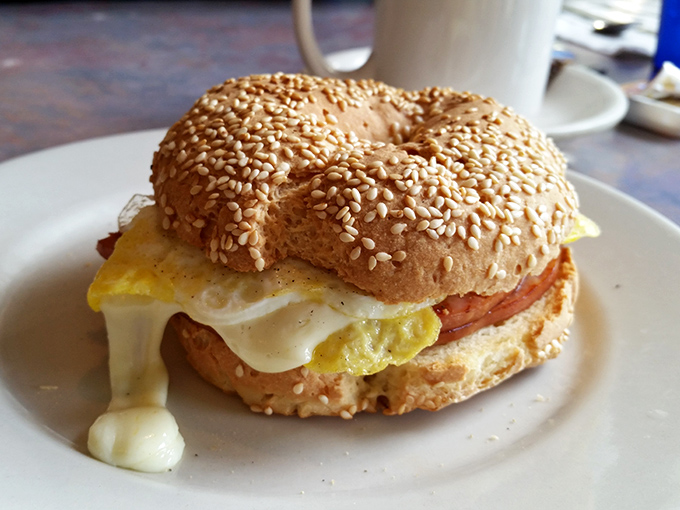 A breakfast sandwich that understands the importance of proper architecture. That melty cheese is making a break for freedom, and who could blame it?