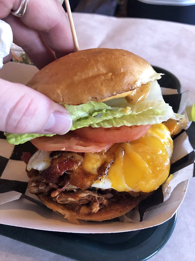 
The ultimate power move: pulled pork topped with cheese, bacon, and a fried egg. This isn't just a sandwich&mdash;it's a commitment to excellence.