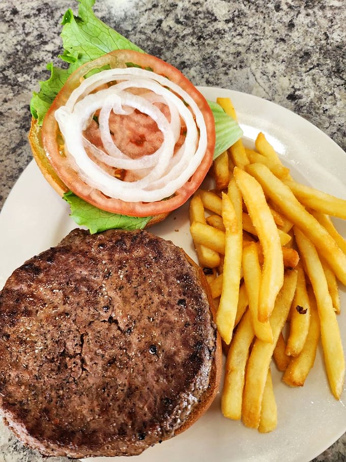 A burger that doesn't need a fancy name or artisanal pretensions—just honest beef, proper toppings, and fries that actually taste like potatoes.