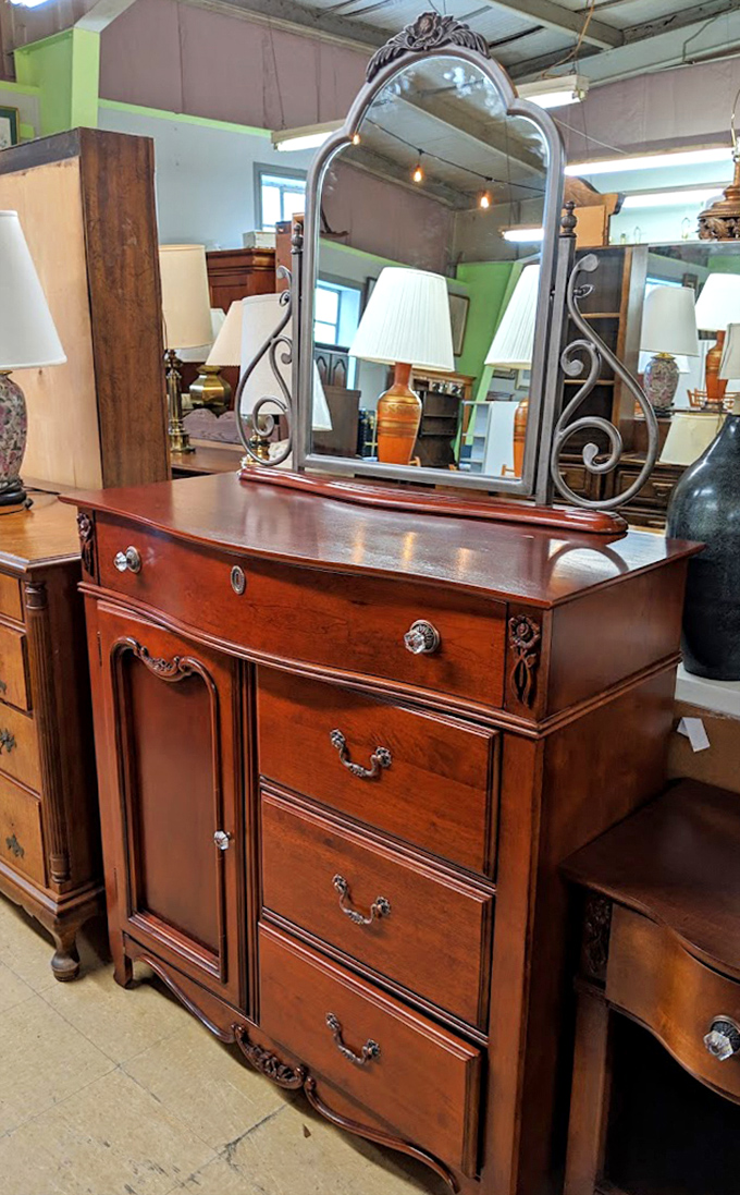 A mahogany dresser with mirror that's seen more morning routines than a barista at the busiest Starbucks in Manhattan.