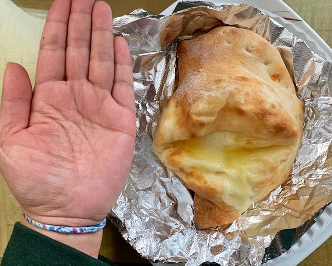 The calzone &ndash; pizza's mysterious cousin who keeps all the good stuff hidden inside, like a delicious secret agent.