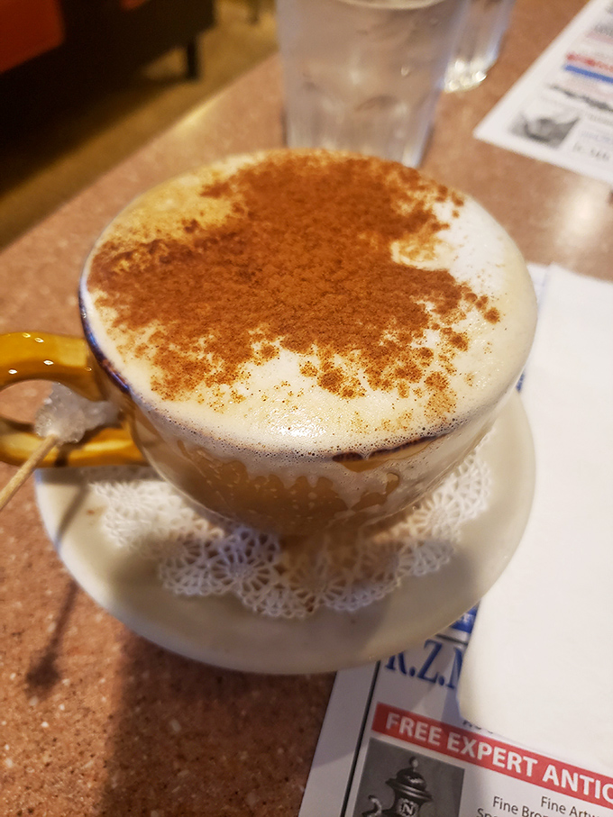 This isn't just coffee &ndash; it's a cappuccino wearing a cinnamon suit, ready for its close-up on the cover of "Beverages Monthly."