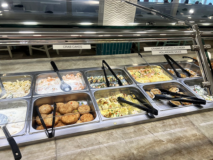 Crab cakes and stuffed flounder await their admirers at the buffet line. Each tray holds carefully prepared treasures that would make Neptune himself reach for a plate.