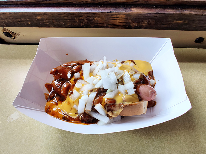 This chili cheese dog with diced onions and pickles is what happiness looks like if it decided to take the form of lunch.