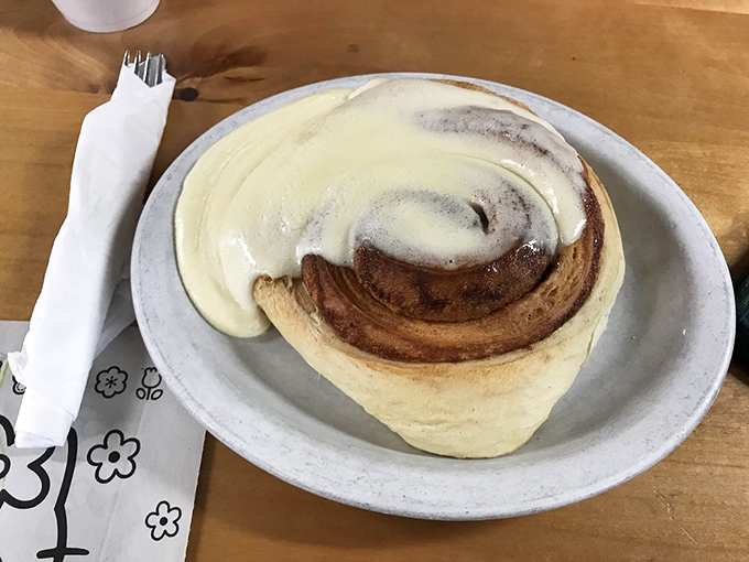 Their cinnamon roll isn't just big—it's the "needs its own zip code" kind of massive, with frosting that dreams are made of.