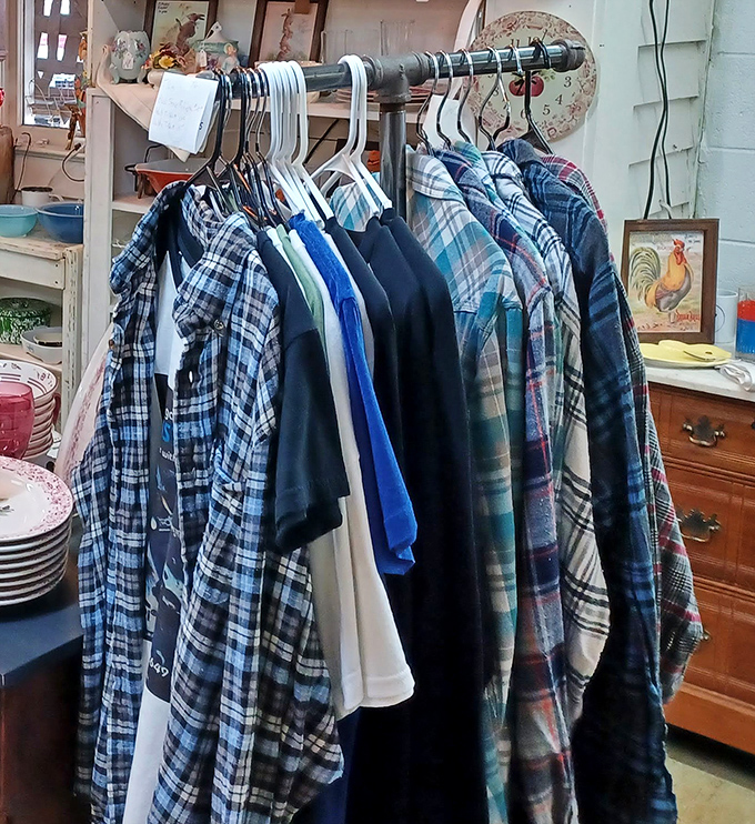 Flannel shirts and vintage clothing hang in patient formation. Someone's 1970s fashion statement is today's "authentic vintage find."