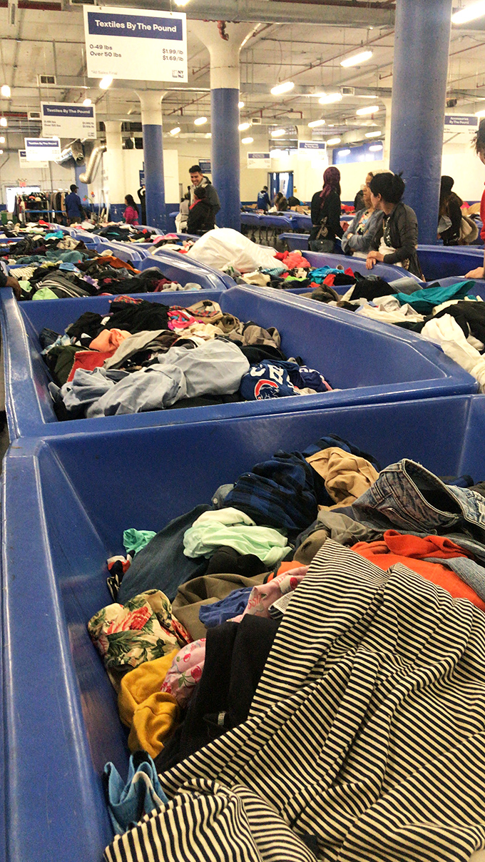 The textile treasure hunt continues with layers upon layers of potential. Each bin dive might reveal last season's designer pieces hiding beneath everyday basics.