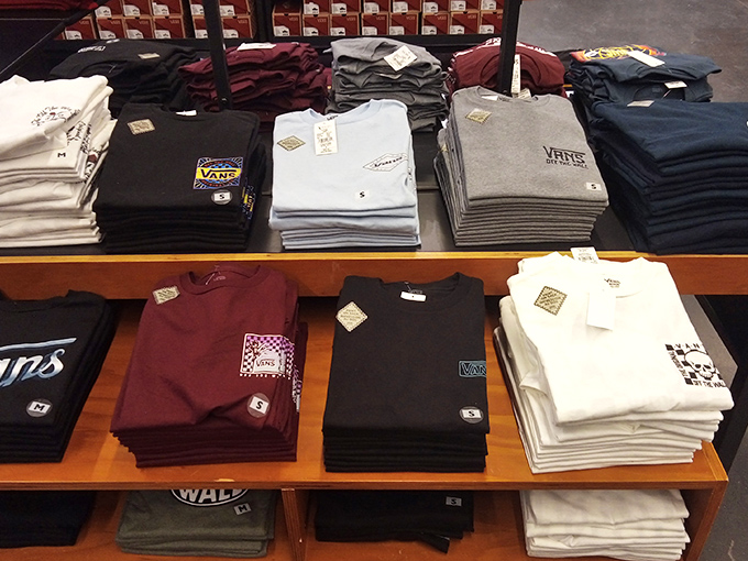 Perfectly folded stacks of Vans tees&mdash;retail origami that will be undone within seconds of eager shoppers spotting their size.