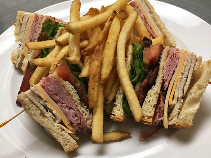 The club sandwich&mdash;that reliable triple-decker masterpiece where turkey, bacon, and bread achieve perfect harmony, with fries playing the delicious supporting role.