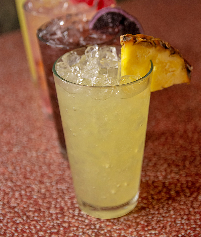 A tall, frosty pineapple drink that promises a momentary tropical vacation, regardless of the Maryland weather happening outside the diner's windows.