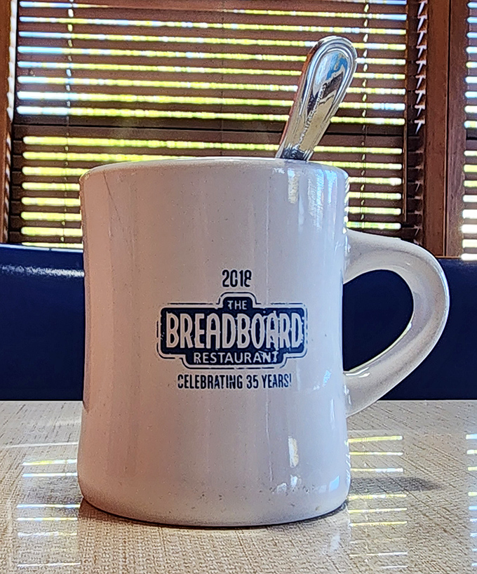 A sturdy mug proudly displaying decades of breakfast history, ready to deliver the caffeine necessary for tackling whatever the day throws your way.