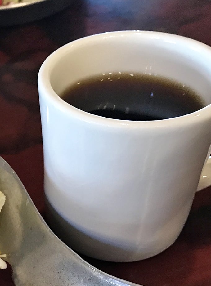 The lifeblood of road trips and early mornings &ndash; a simple cup of coffee that somehow tastes better in a diner mug.