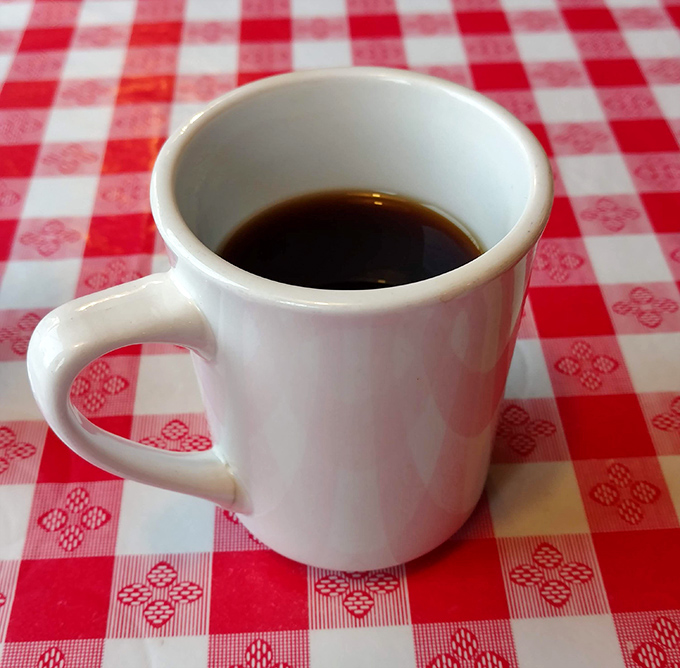 That classic white diner mug &ndash; holding liquid ambition that's fueled American mornings since time immemorial.