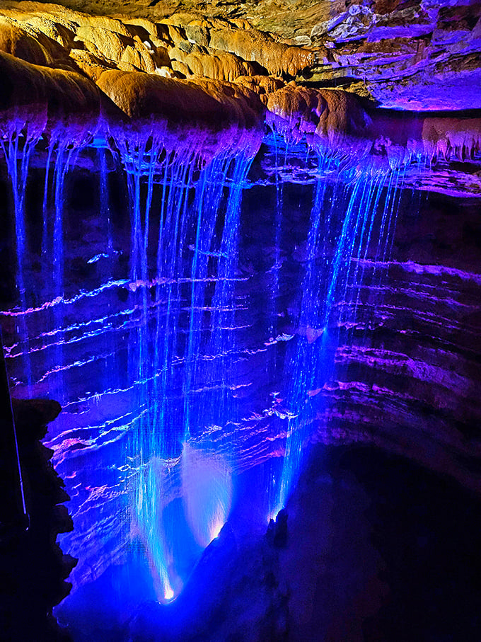 Electric blue lighting transforms ordinary cave formations into an Avatar-worthy landscape that feels more alien planet than Missouri.