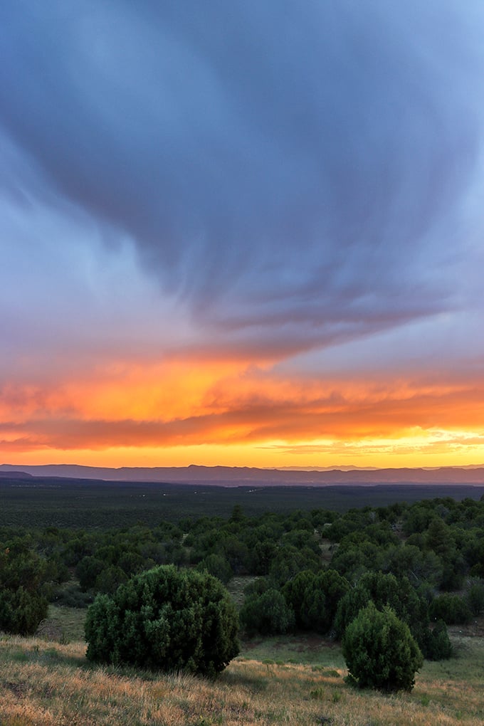 Sunset skies ablaze with color that would make even the most dedicated smartphone photographer put down their device and simply stare.