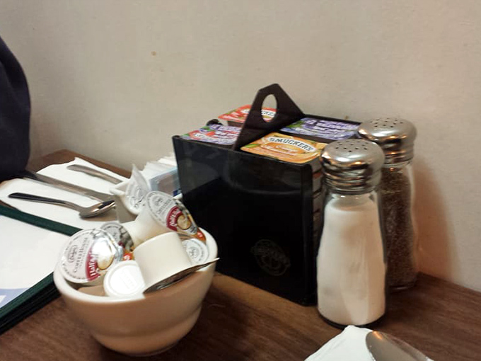 The holy trinity of diner dining: salt, pepper, and a caddy of assorted jams – simple pleasures for simple needs.