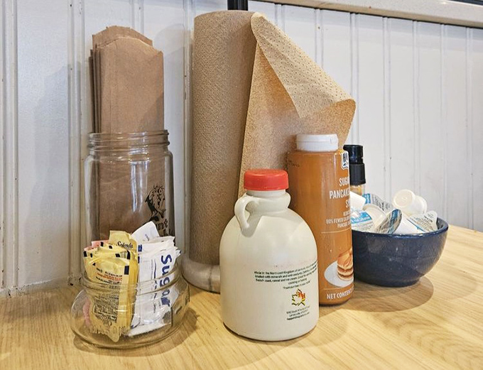 The condiment station&mdash;where maple syrup meets hot sauce in that uniquely Florida harmony that somehow makes perfect sense.