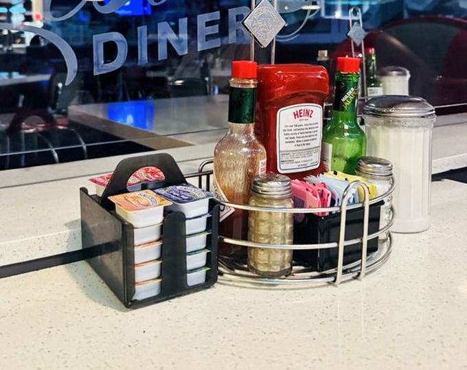 The condiment caddy&mdash;that silent hero of diner dining, ready to customize your meal to perfection with a squeeze or splash.
