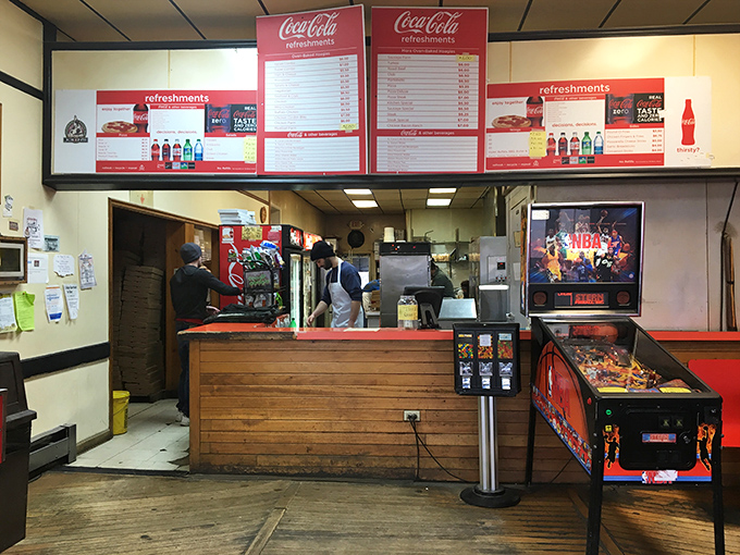 The ordering counter&mdash;where dreams are placed and hunger pangs go to die, all under the watchful gaze of Coca-Cola signage.