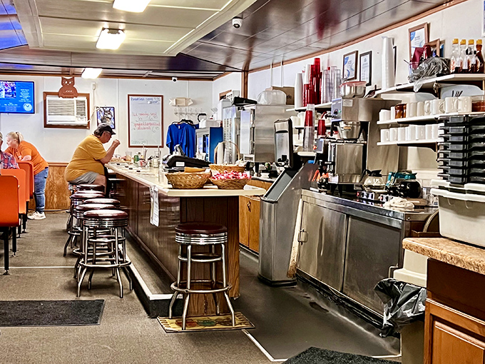 The counter – where solo diners find community, regulars have "their spot," and the coffee cup never reaches empty before a refill appears.