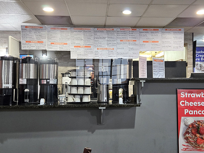 The order counter&mdash;command central for breakfast operations, where coffee flows freely and menu boards promise delicious possibilities.