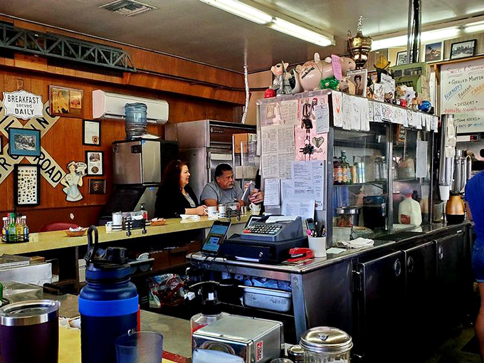 The counter view: where coffee refills are prompt and breakfast magic happens at the speed of hunger.