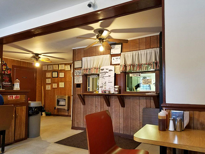 Wood-paneled walls and vintage charm create an atmosphere where time slows down and appetites speed up considerably.
