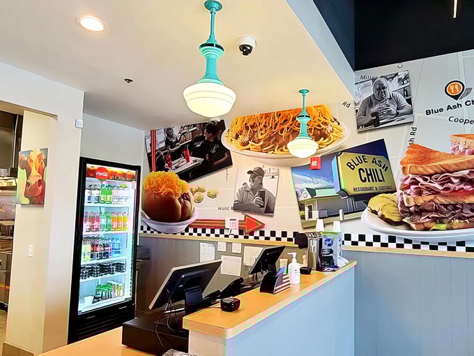 At the counter, food magic happens beneath vintage-inspired pendant lights and nostalgic wall decorations.
