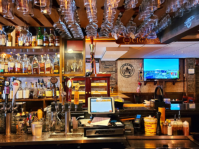 A bar setup that says, "Yes, we take our cocktails as seriously as our steaks." The glasses hanging above are standing by.