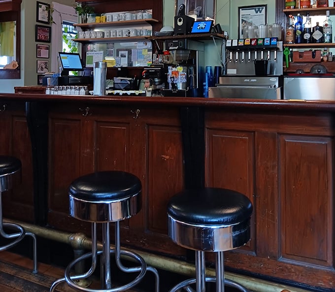 Wooden bar stools invite you to perch and watch the culinary show unfold&mdash;front row seats to the delicious drama of a busy lunch service.