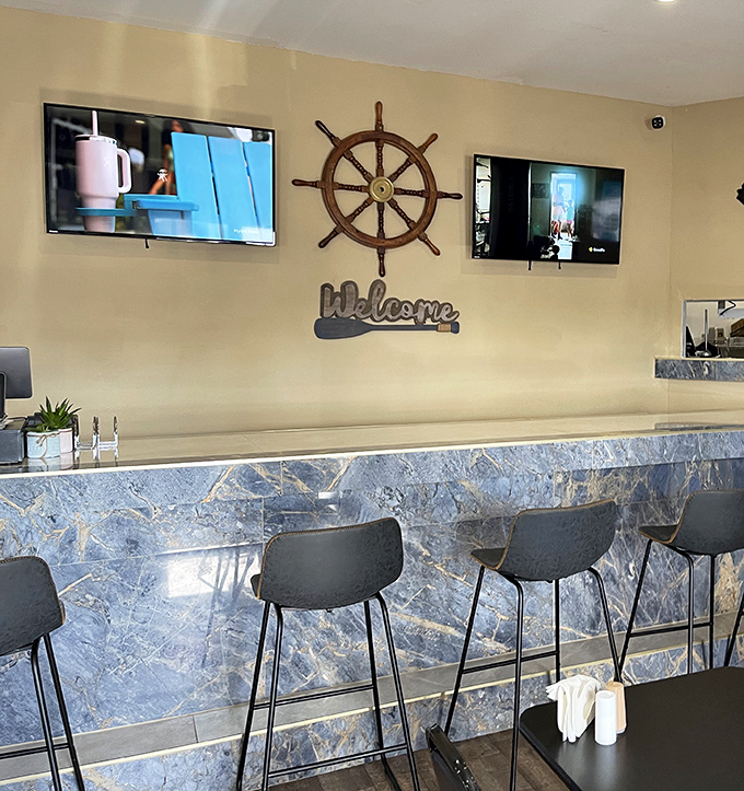 That marble counter looks fancy enough for a yacht club, but welcomes everyone like old friends.