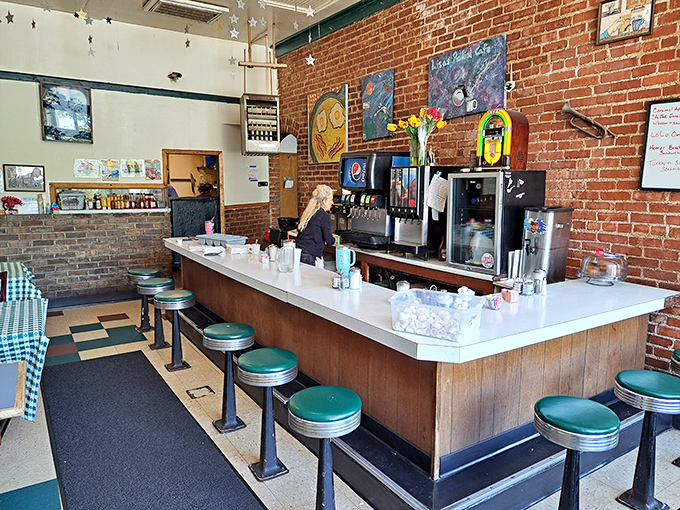 The counter seating offers front-row tickets to the breakfast show. Those green vinyl stools have supported generations of hungry Nebraskans waiting for their morning fix.