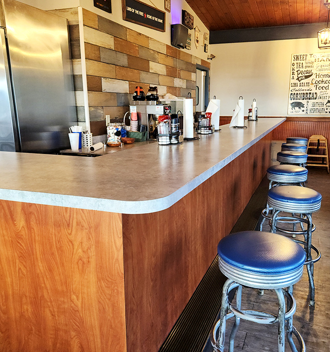 Counter seating where regulars perch and stories are exchanged over plates of homestyle cooking and endless coffee refills.