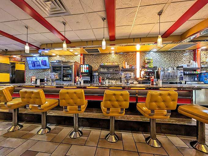 The counter seating—where solo diners become temporary family and the short-order ballet unfolds before you like delicious performance art.